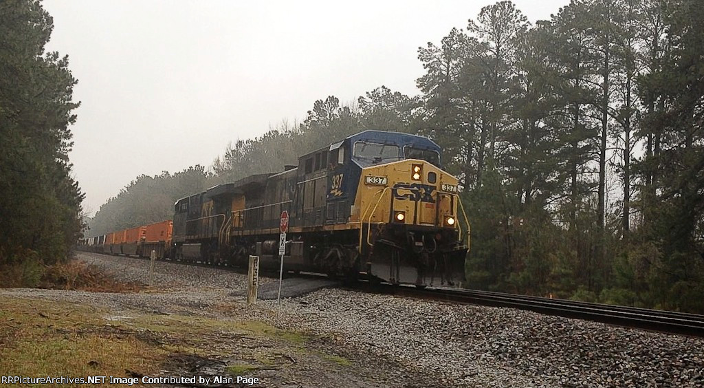 On a rainy March 28, CSX AC44CW 337 and ES40DC 5374